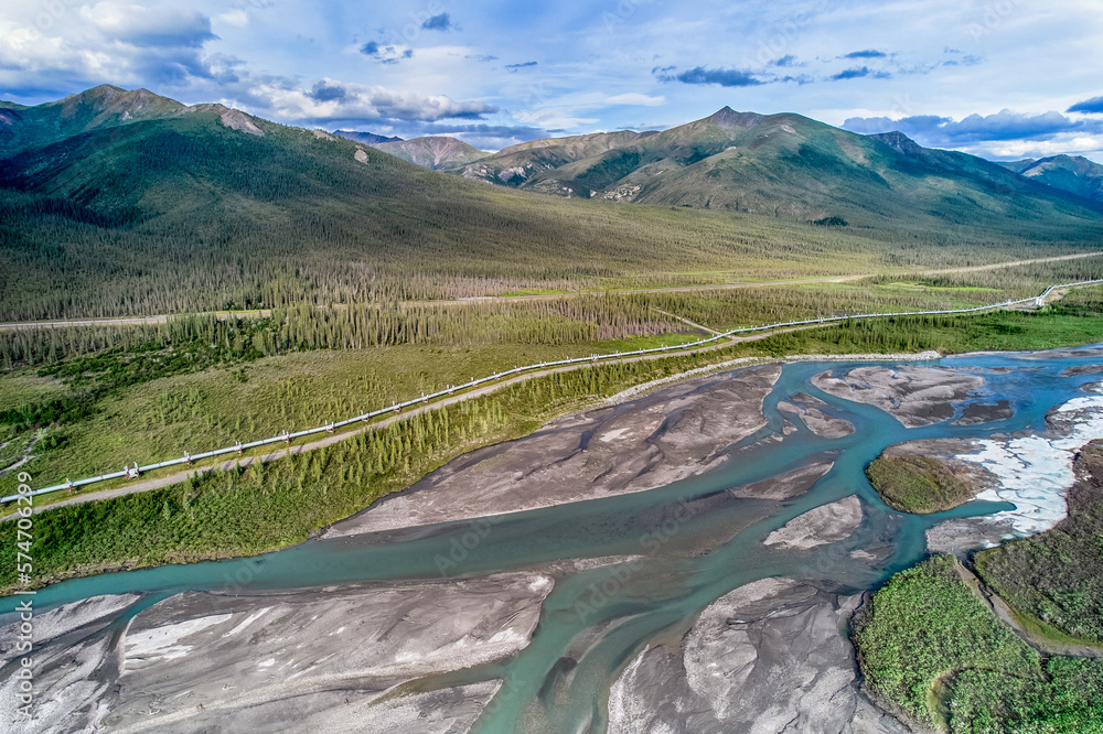 Aerial Drone image of the Braided looking Dietrich River with fresh July snowfall and the Alaska ...