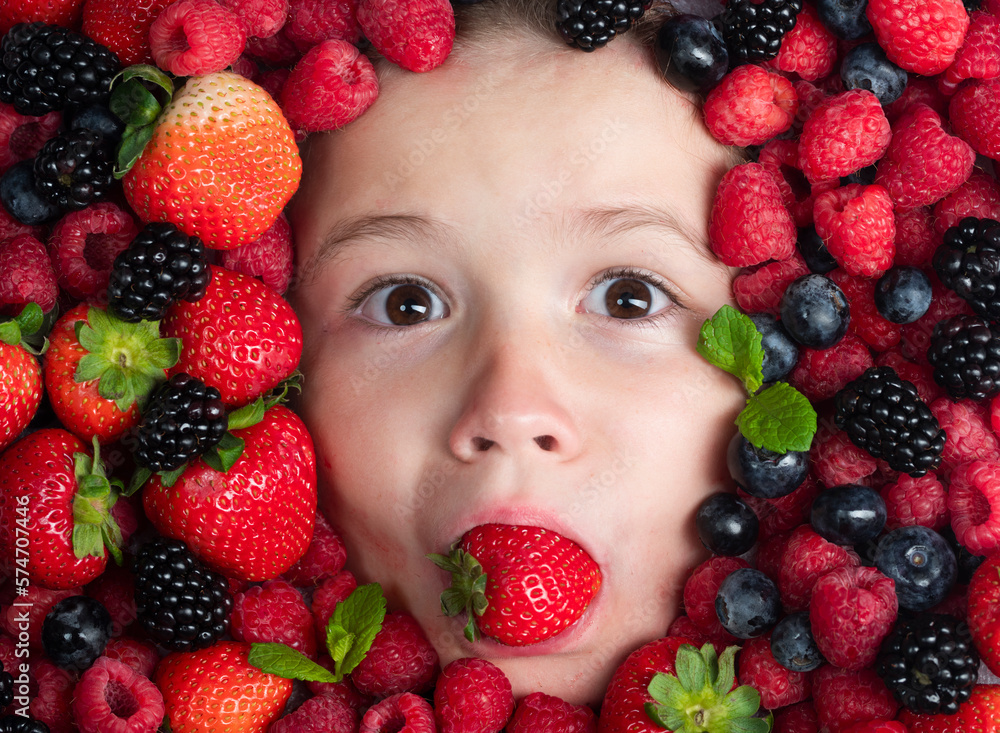 Top view photo of child face with berri. Berry set near kids face. Cute ...