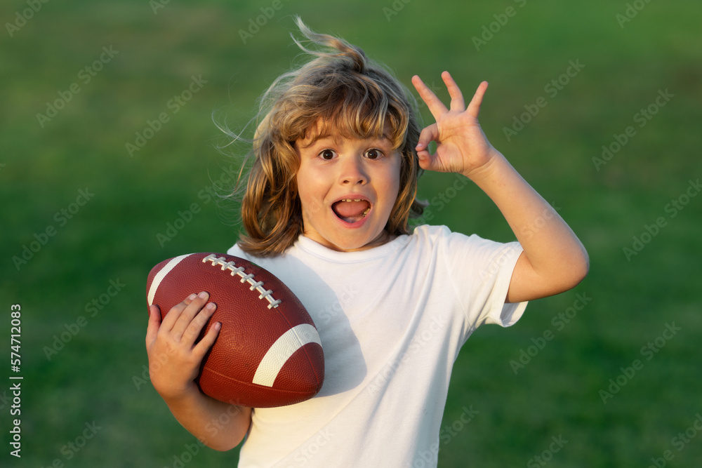 Kids and sports. Young boy playing american football. Kid boy playing ...