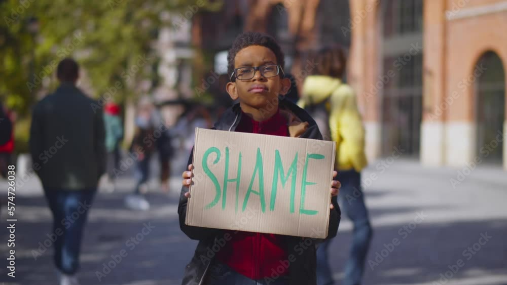 African-American teenage boy stand outside school with shame poster ...