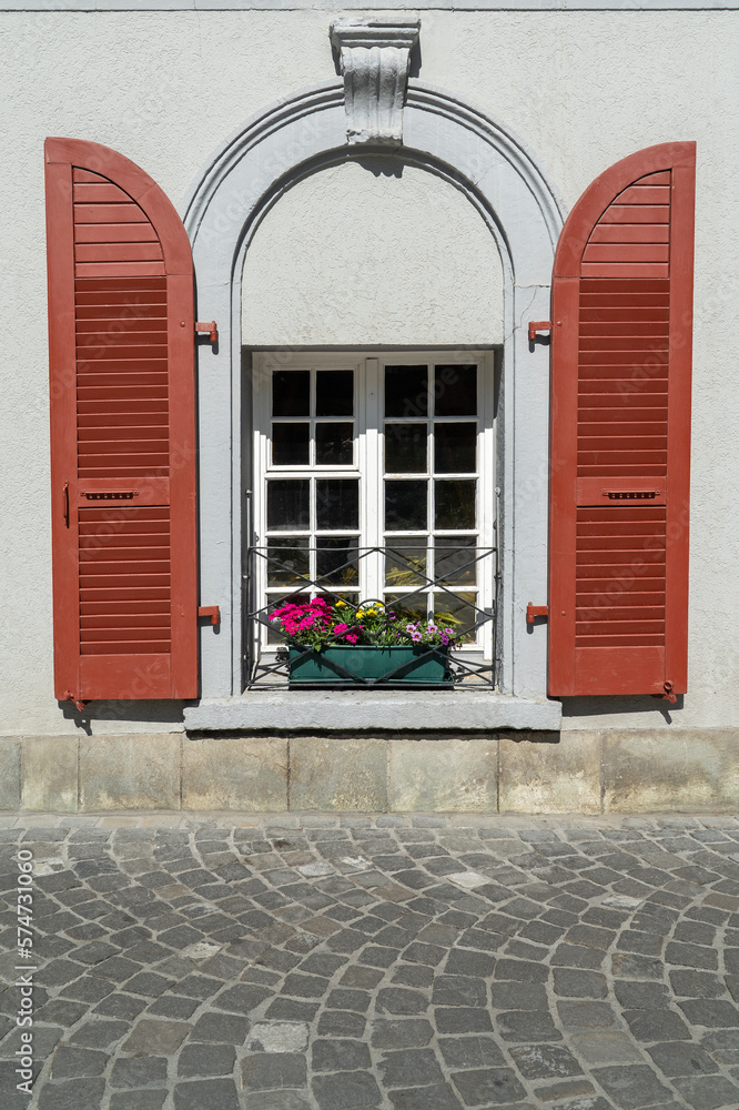 The walls of the house are made of strong cement, painted in gray, with ...