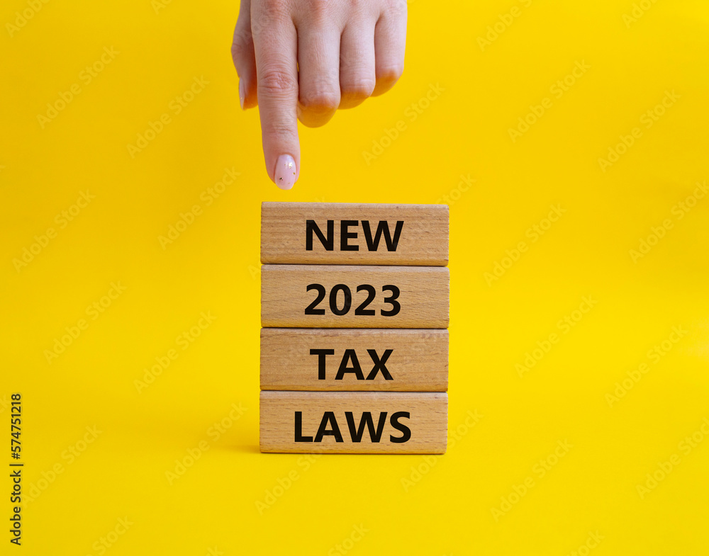 New 2023 Tax Law symbol. Wooden blocks with words New 2023 Tax Law ...