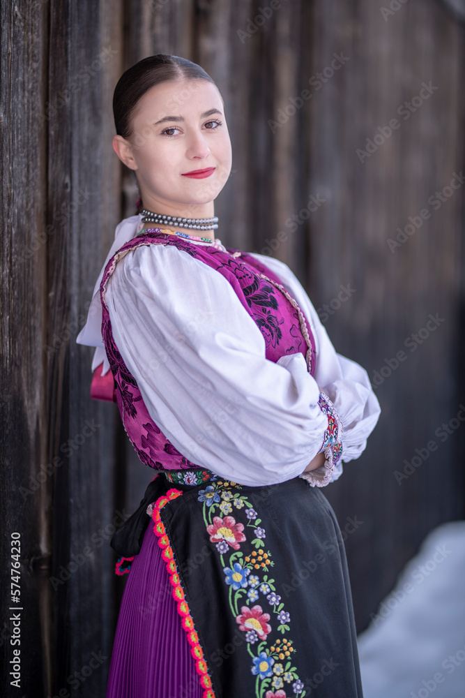 Foto de Young beautiful slovak woman in traditional costume. Slovak ...