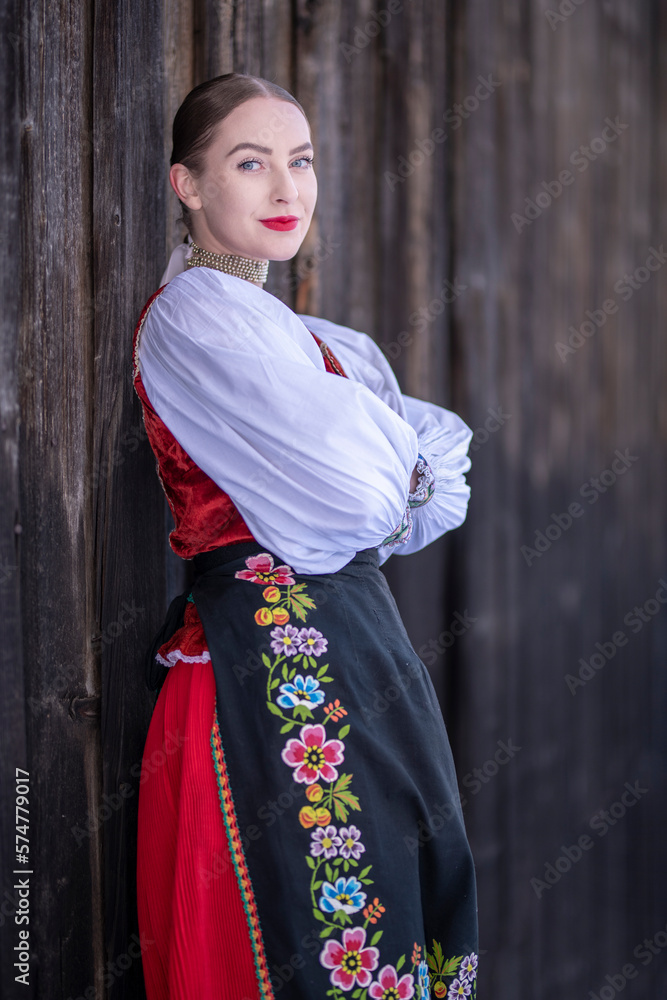 Young beautiful slovak woman in traditional costume. Slovak folklore ...