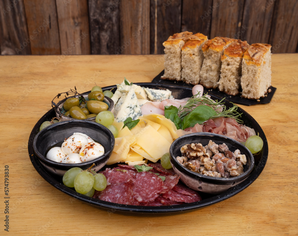Obraz Antipasto. Closeup view of a dish with sliced salami, cheese ...