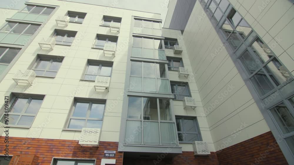 Numbers on facade of multistory apartment buildings in city block low ...