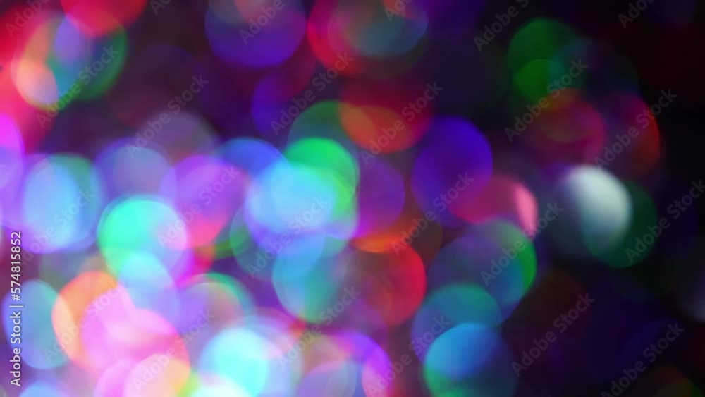 Multicolour bokeh overflows on a black background. Lens Flares Light ...