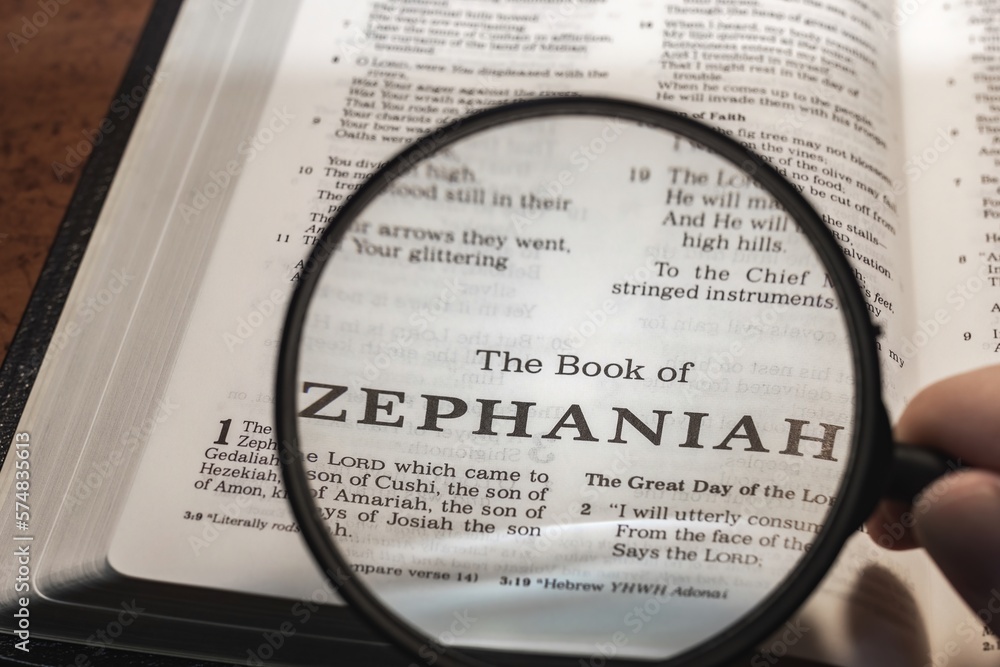 title page book of Zephaniah close up using magnifying glass in the ...