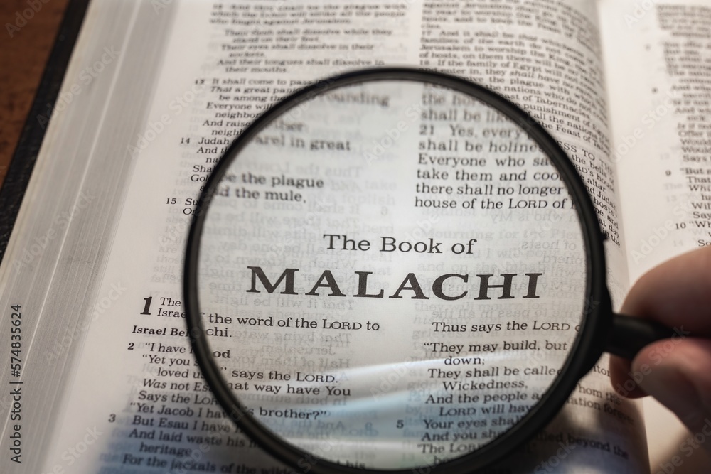 title page book of Malachi close up using magnifying glass in the bible ...