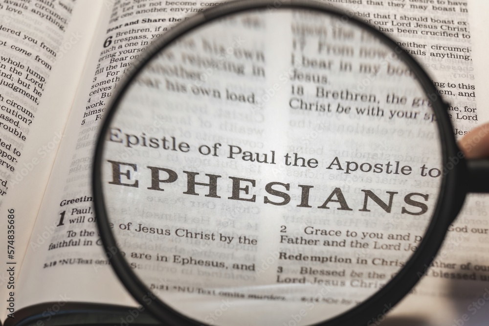 title page book of Ephesians close up using magnifying glass in the ...