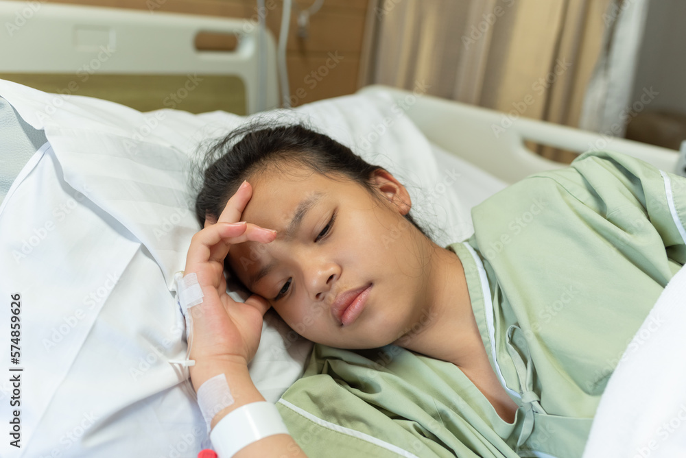 Asian woman patient with medical drip have headache with migraine ...