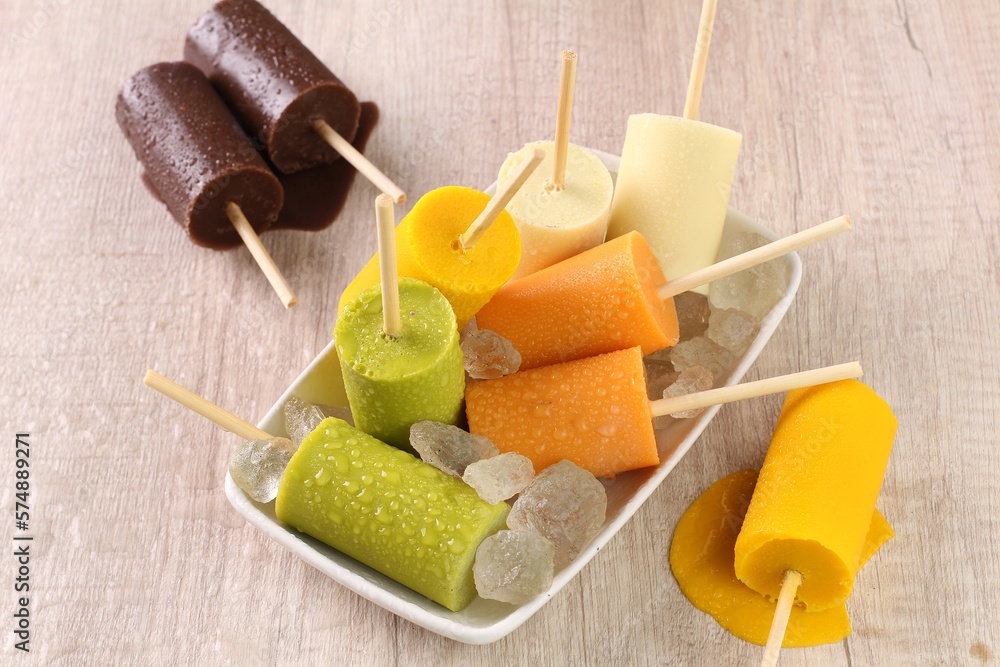 Popsicles or ice candles are refreshing foods in the form of ice with ...