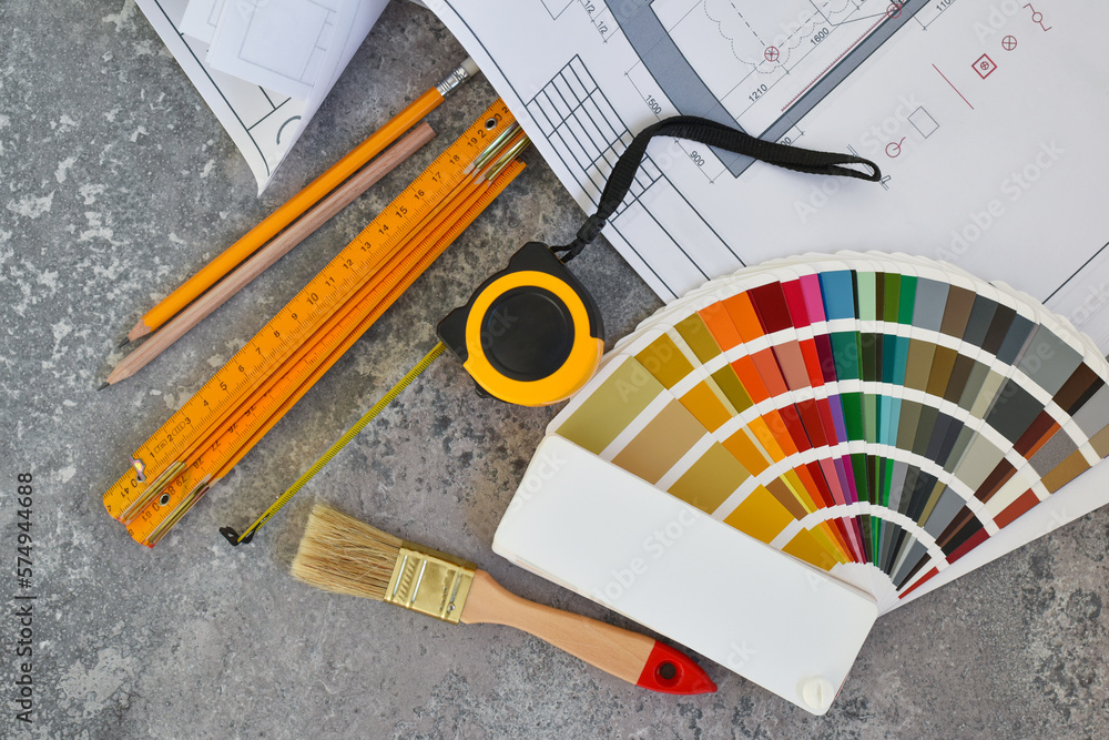 Architectural drawings with color guide, brushes, pencils, ruler on ...