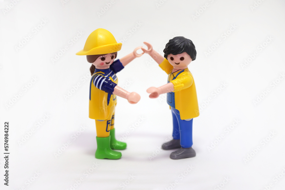 Playmobil figures. Collectible dolls. Toy woman and man in work clothes ...
