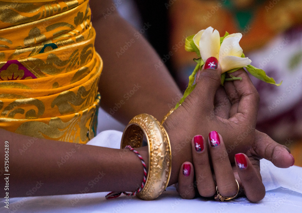 A Teenager Girl With Flowers In The Hands In Traditional Costume Before ...