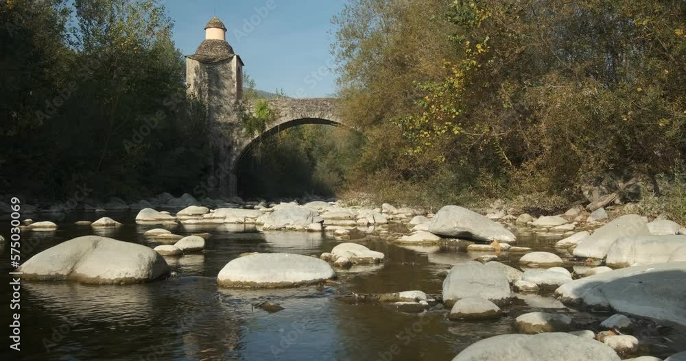 Ancient bridge. Bridge over the river in Lunigiana. The Magra River ...