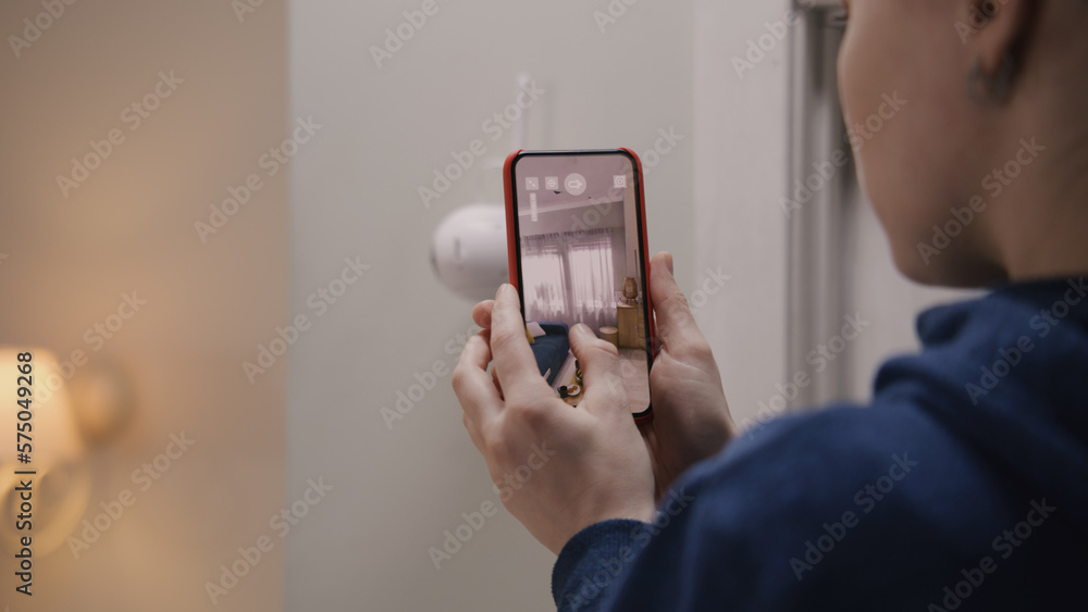 Zdjęcie Stock: Caucasian woman completes installation of security ...