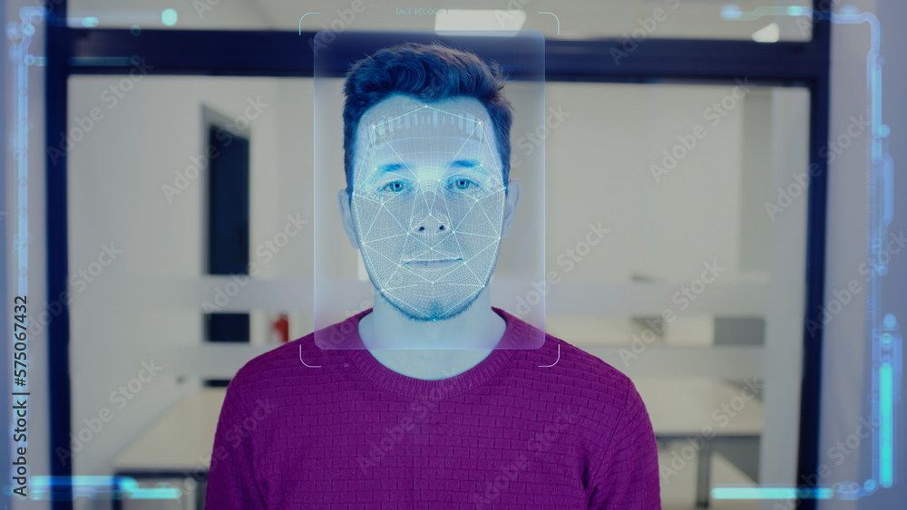Foto de Man scans face in office. He touches sensor and security system ...