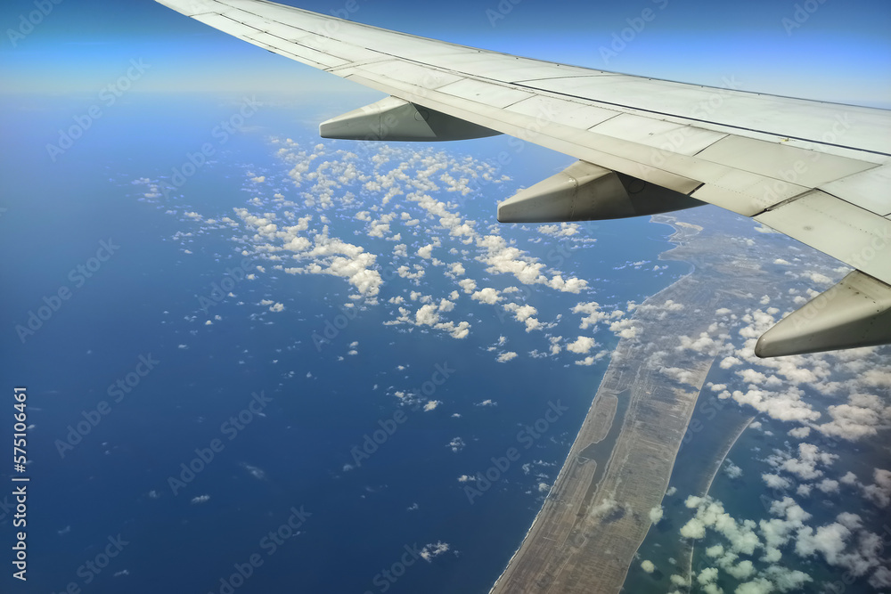 View through airplane window of commercial jet plane wing flying high ...