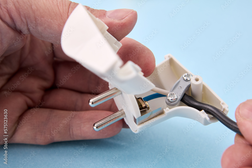 Folding, collapsible European standard plug with an electric cord ...