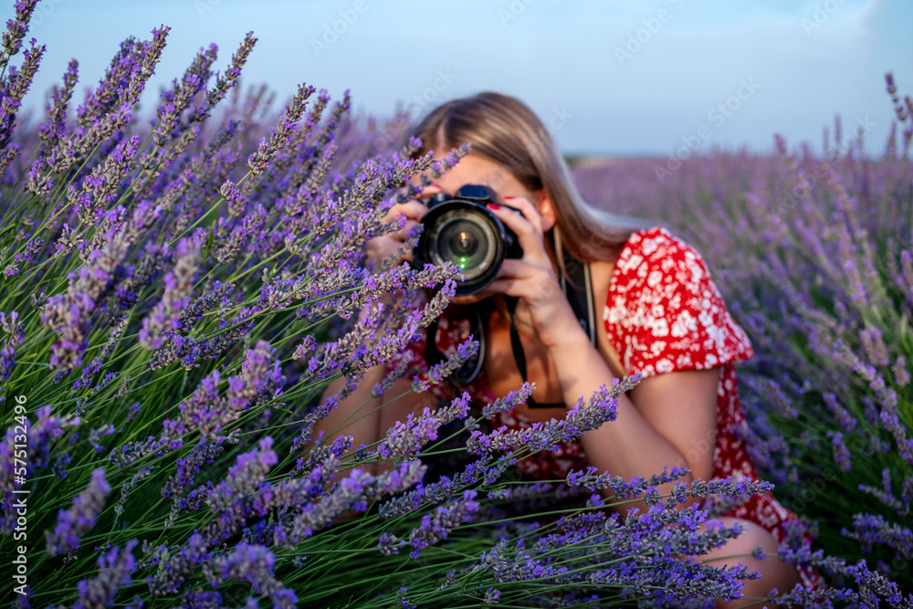 Beautiful woman taking pictures outdoors with a DSLR camera. Female ...