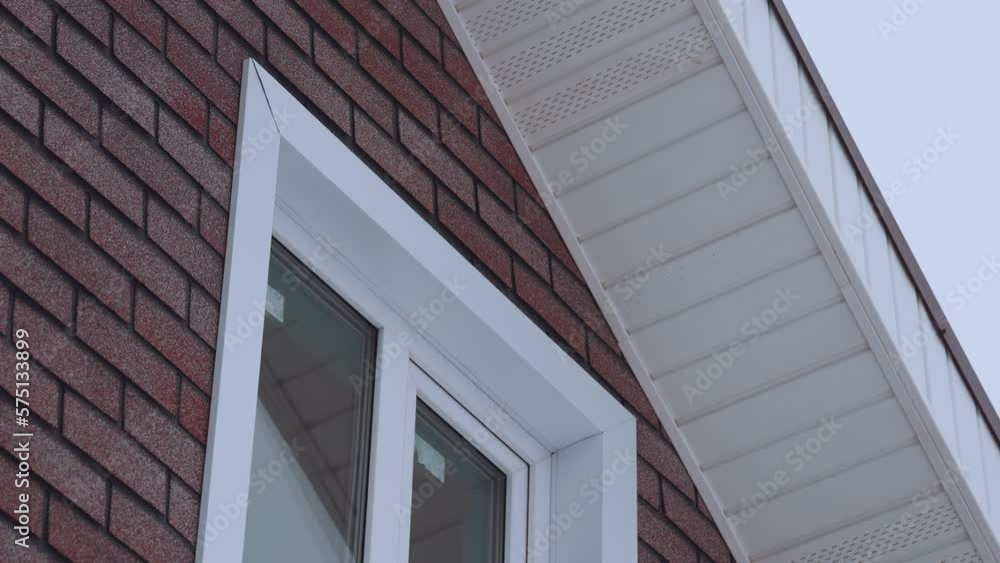 Plastic windows in a frame house, new windows, a private house built, a ...