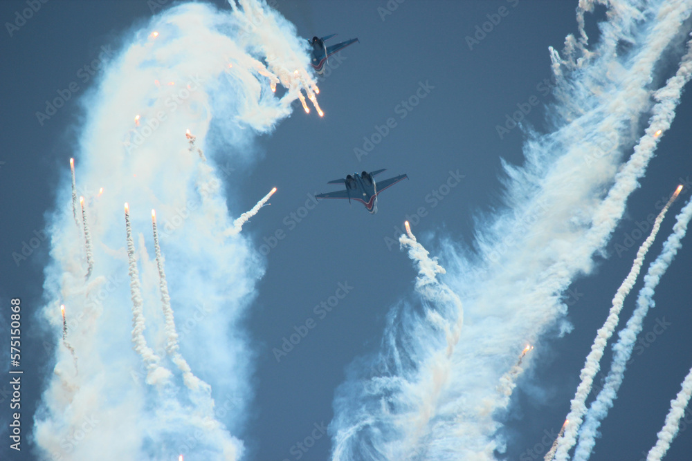 Military aircraft shooting out flares. Flares can be used as a ...
