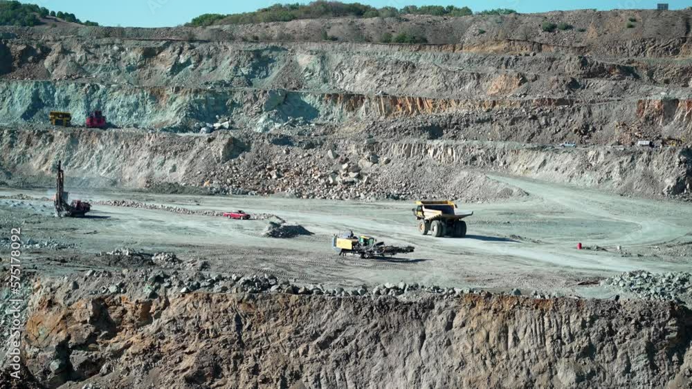 Iron ore quarry open pit mining. Aerial view of excavators and ...