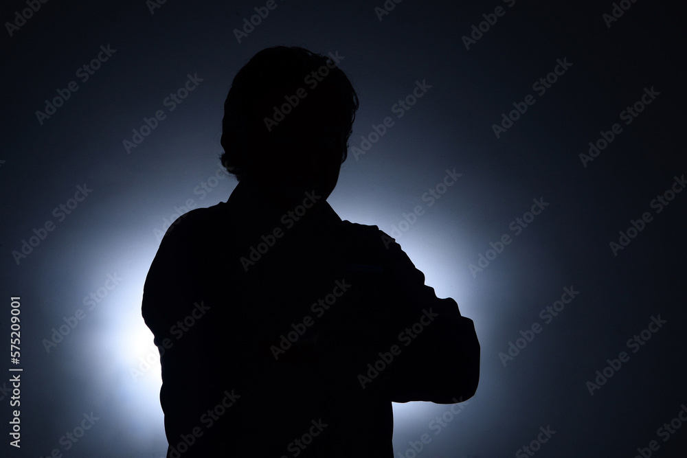 Hidden face in silhouette of an enigmatic man in the shadow. Stock ...