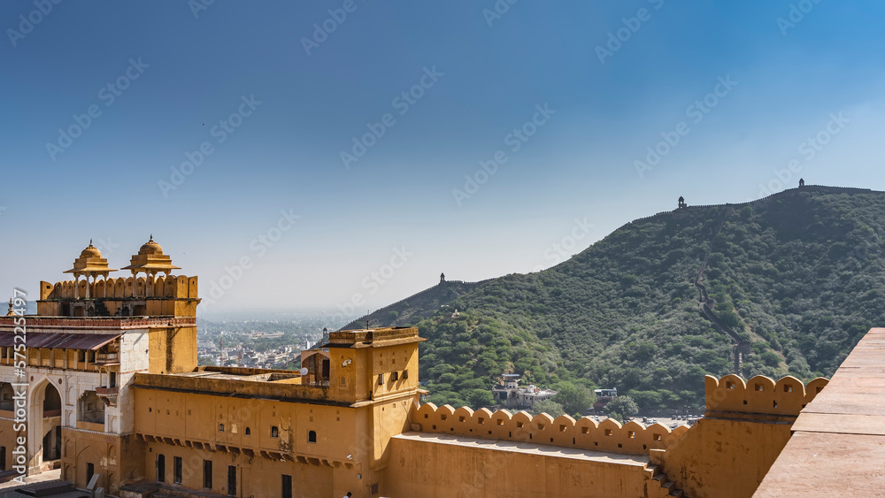 The ancient Amber Fort is built of orange sandstone. The arched ...