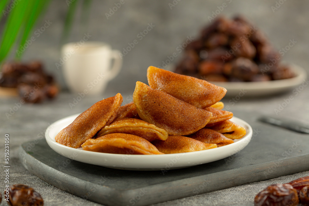 Arabic Oriental sweets , Qatayef dessert with dates , made in ramadan ...