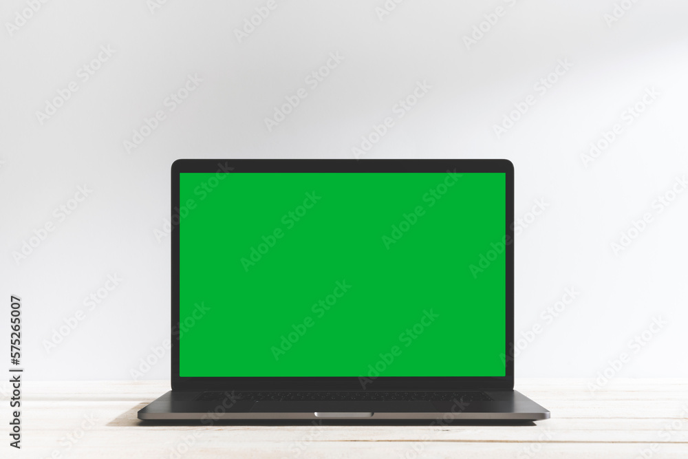 Chroma key green screen laptop on table with white background Stock ...