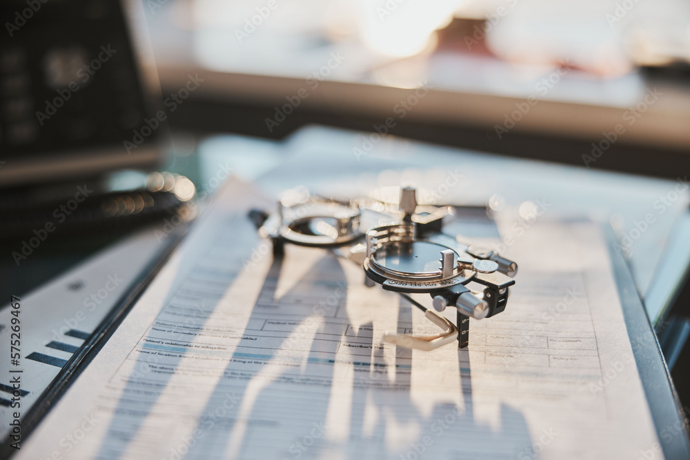 Ophthalmology, test glasses and paperwork on desk for results ...