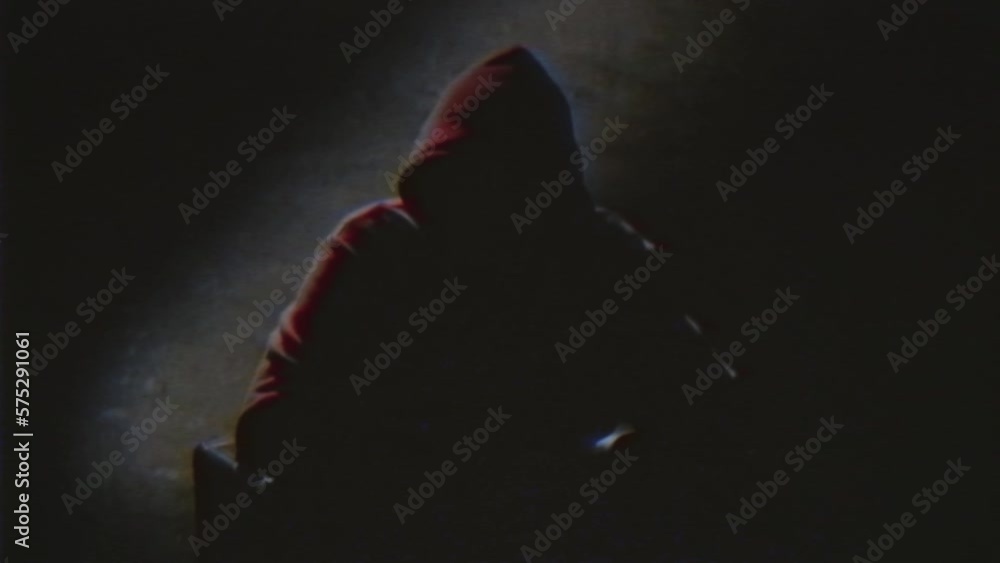 Anonymous man in a hood interview vintage VHS tape style video footage ...