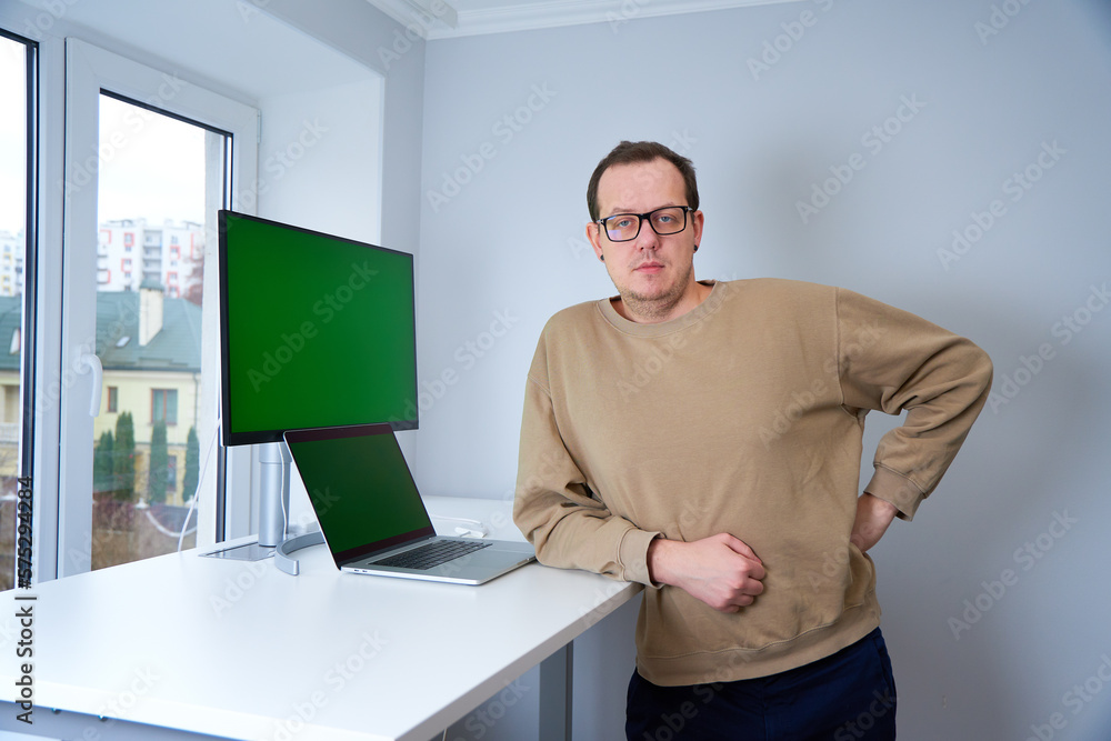 Young IT specialist working remote at home. CEO manager working at his ...