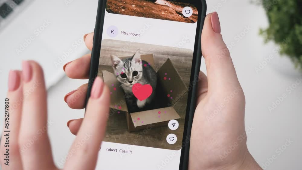 Woman scrolls through her social media feed and gives some photos a ...