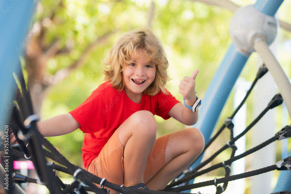 Little boy playing on the playground. The emotion of happiness, fun ...