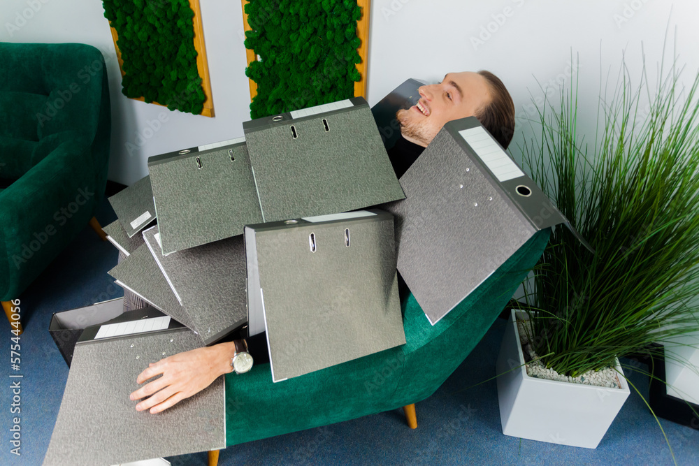 Unhappy employee has a bad day at work and burnout, sitting on the ...