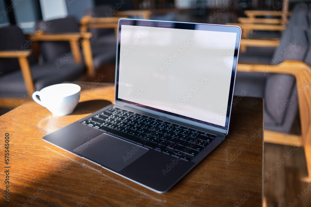 Laptop with blank screen on table. Workspace background new project on ...