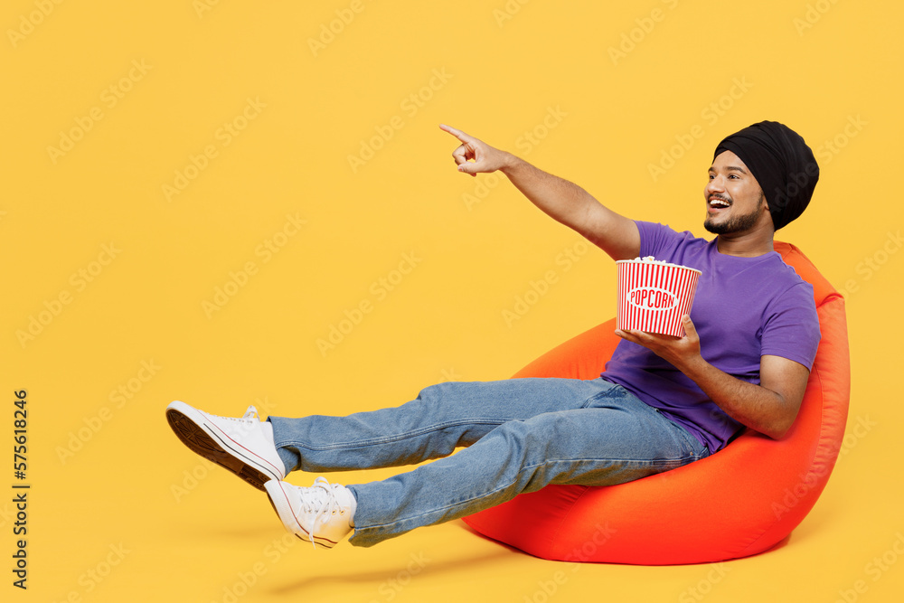 Full body devotee Sikh Indian man ties his traditional turban dastar ...