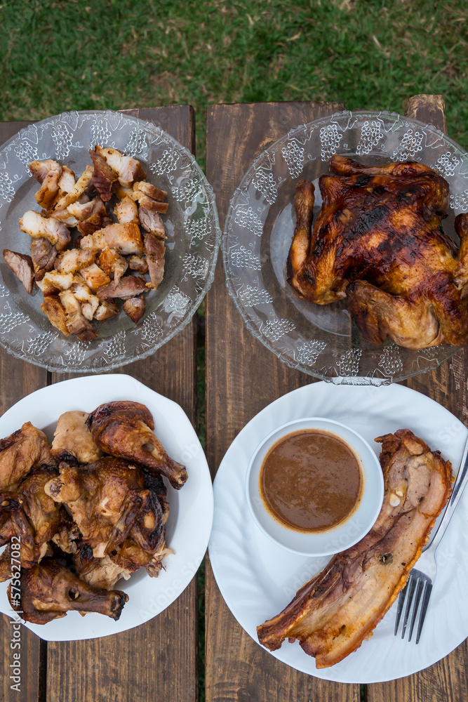 Plates of Lechon Manok or roasted chicken and Liempo or grilled pork ...