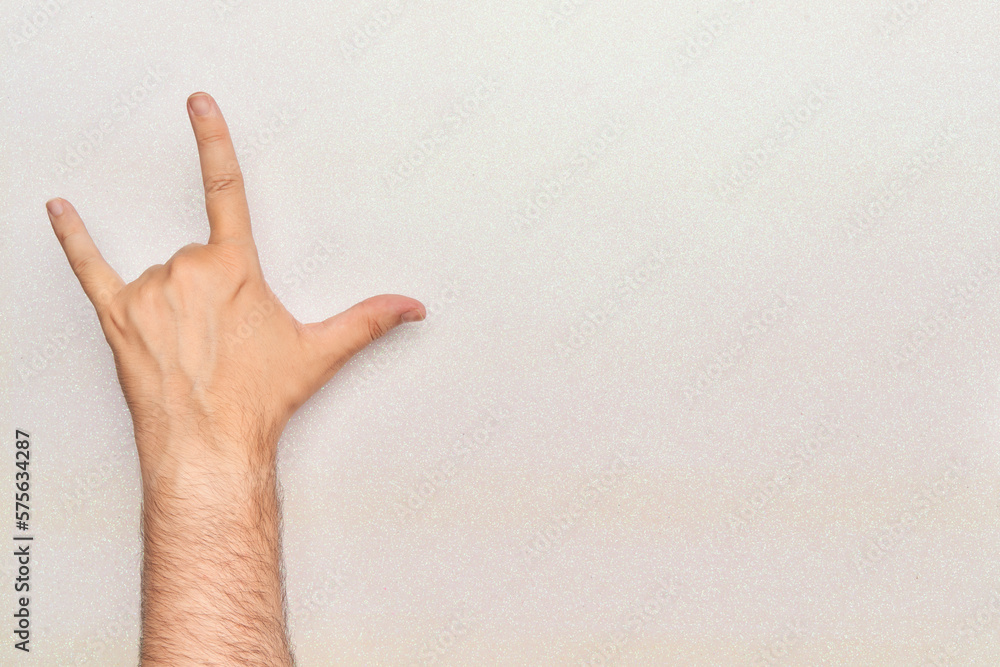 hand gesture horns rock and roll skateboarding with 3 fingers on white ...