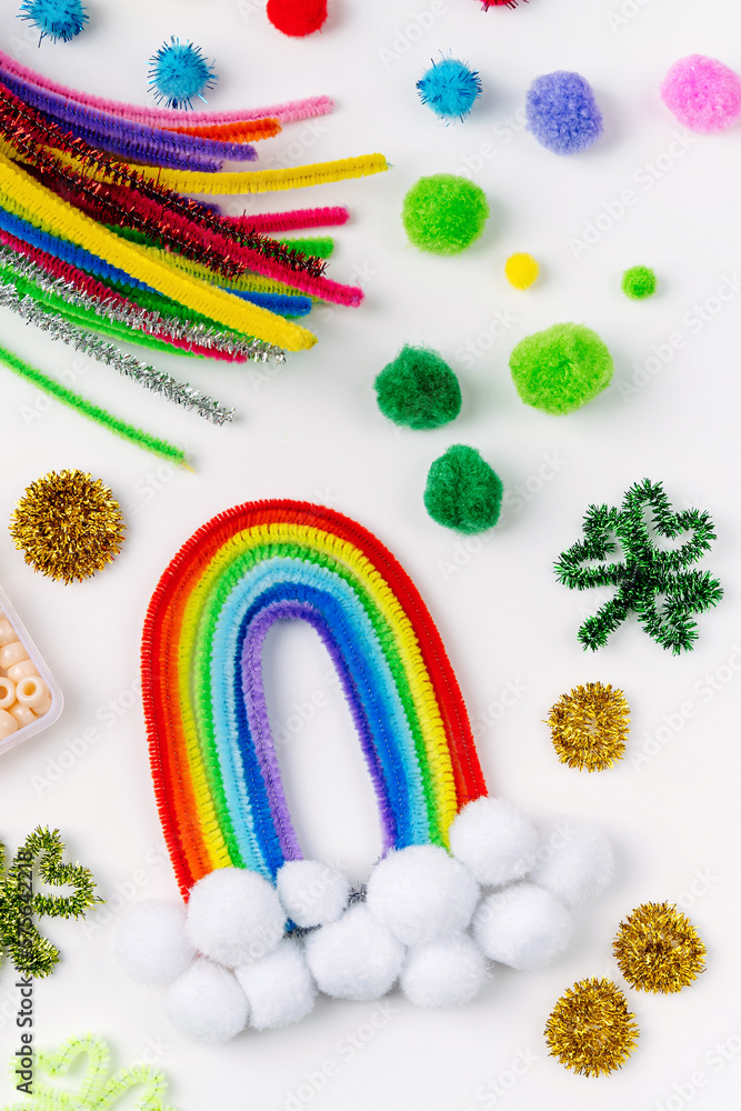 Rainbow and clover made of beads and pipe cleaners with different multi ...