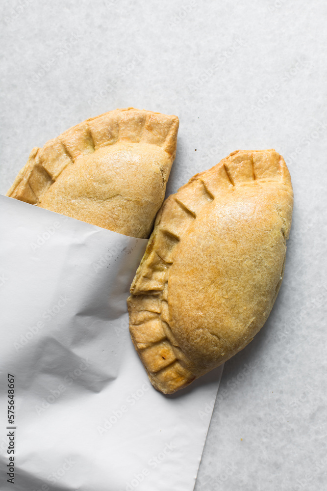 Nigerian meat pie in white bakery bag, freshly baked nigerian meat pie ...