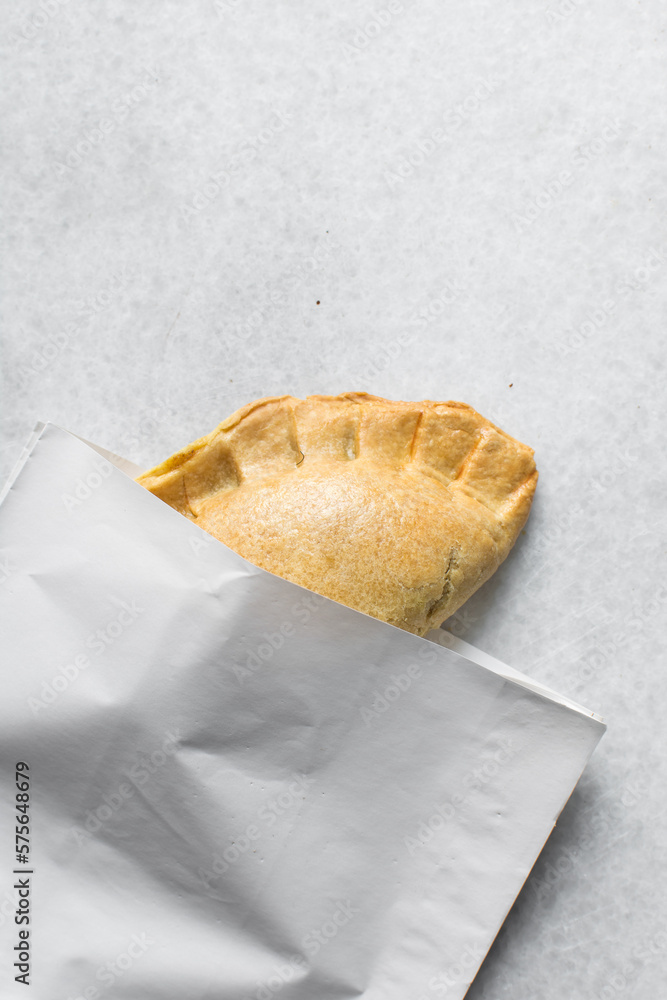 Nigerian meat pie in white bakery bag, freshly baked nigerian meat pie ...