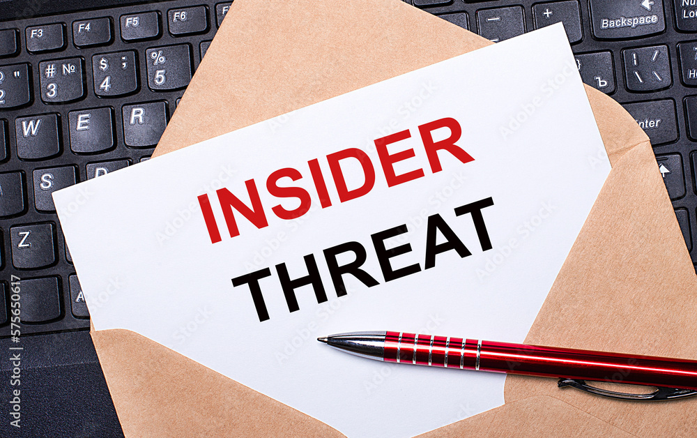 White card with the text INSIDER THREAT in a craft envelope on a work ...