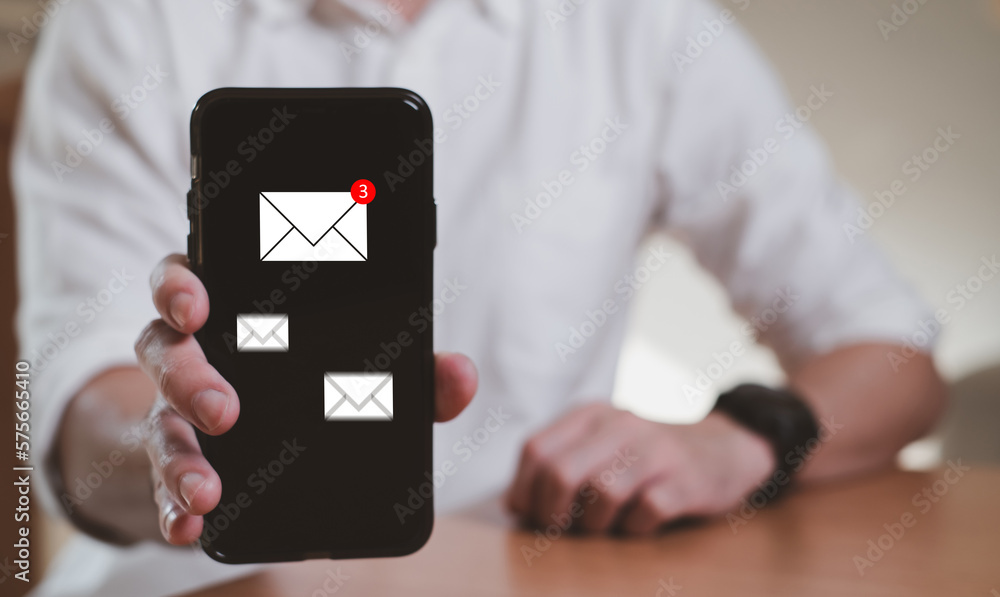 Businessman working in front of laptop computer while check email or ...