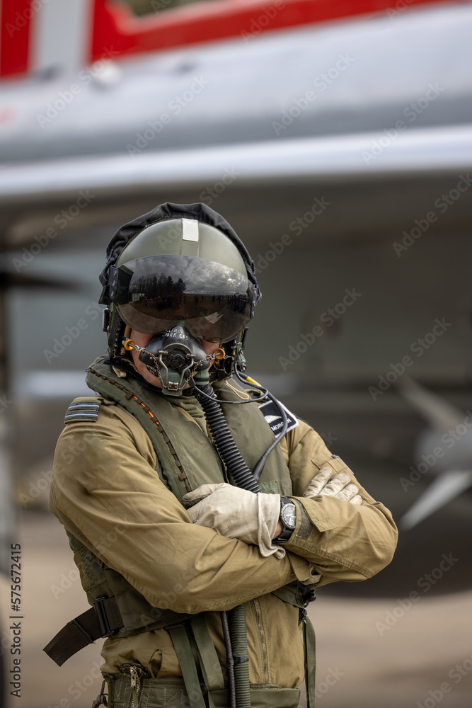 Military Fighter Pilot with helmet, visor and oxygen mask in flying ...