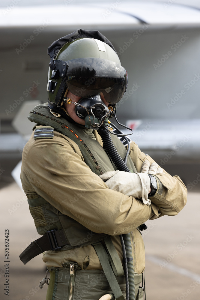 Fighter Pilot with helmet, visor and oxygen mask in flying suit with ...