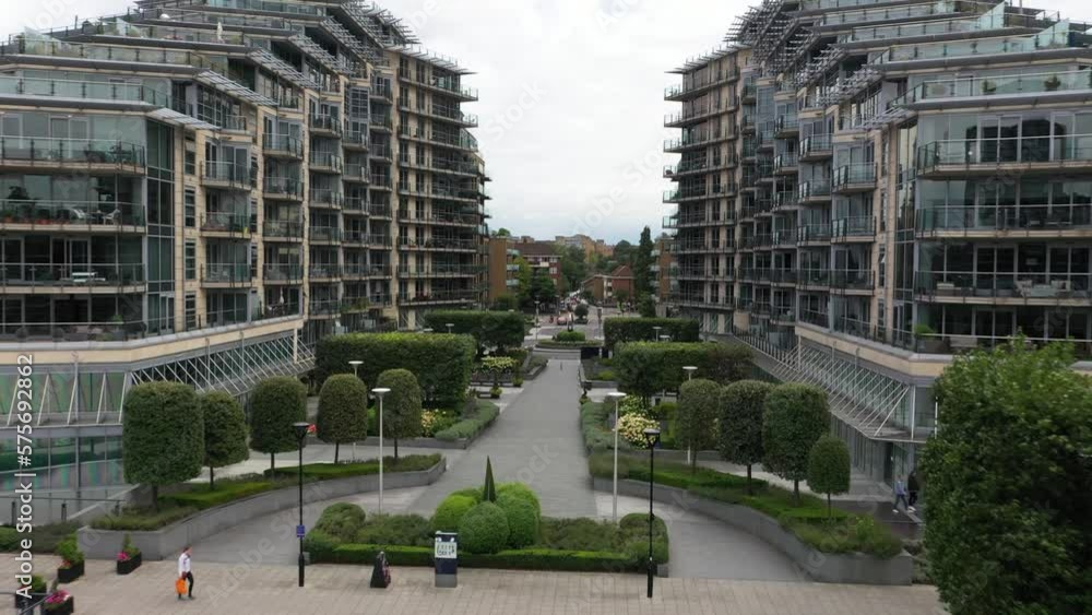 Walkway and zones with greenery between tall apartment buildings. Stock ...